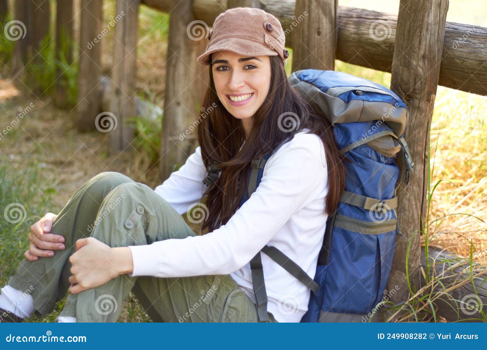 Resting before. a Young Hiker Resting with a Backpack on Her Back ...