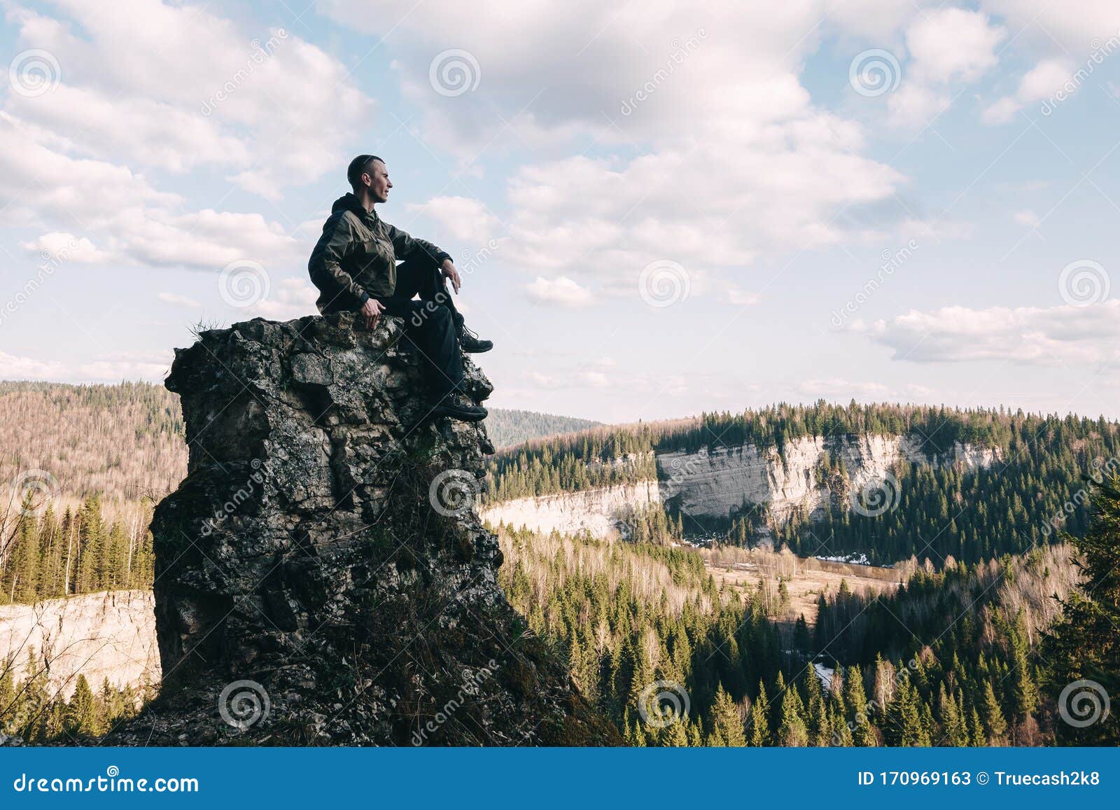 Young Hiker Sitting and Relaxing on Top of a Mountain Stock Image ...