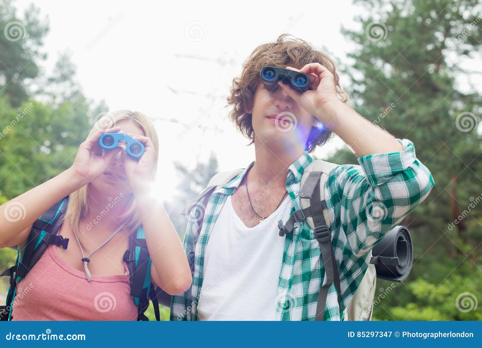 Young Hiking Couple Using Binoculars in Forest Stock Image - Image of ...