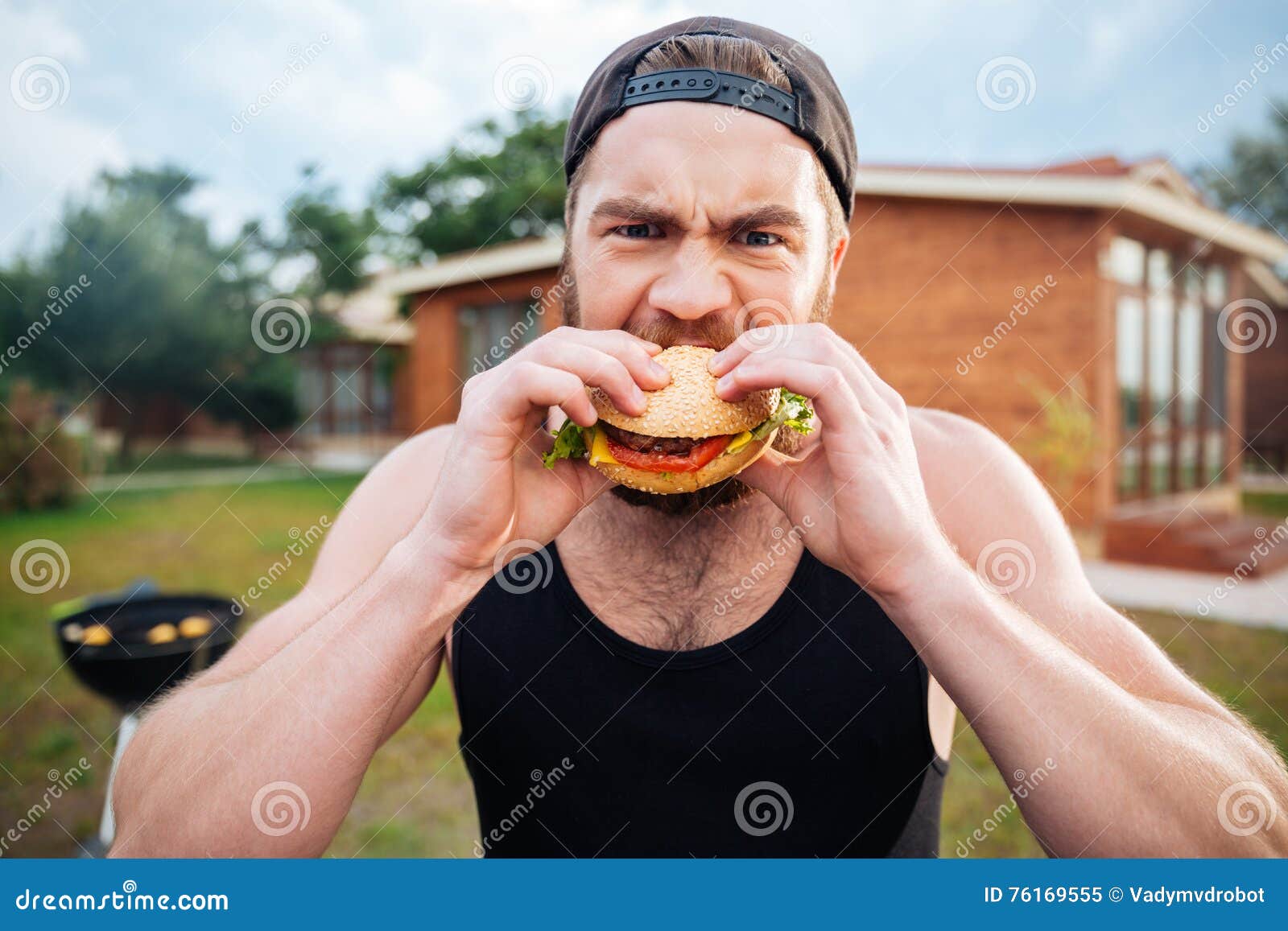 Young Hipster Guy Eating Delicious Burger Outdoors Stock Image - Image ...