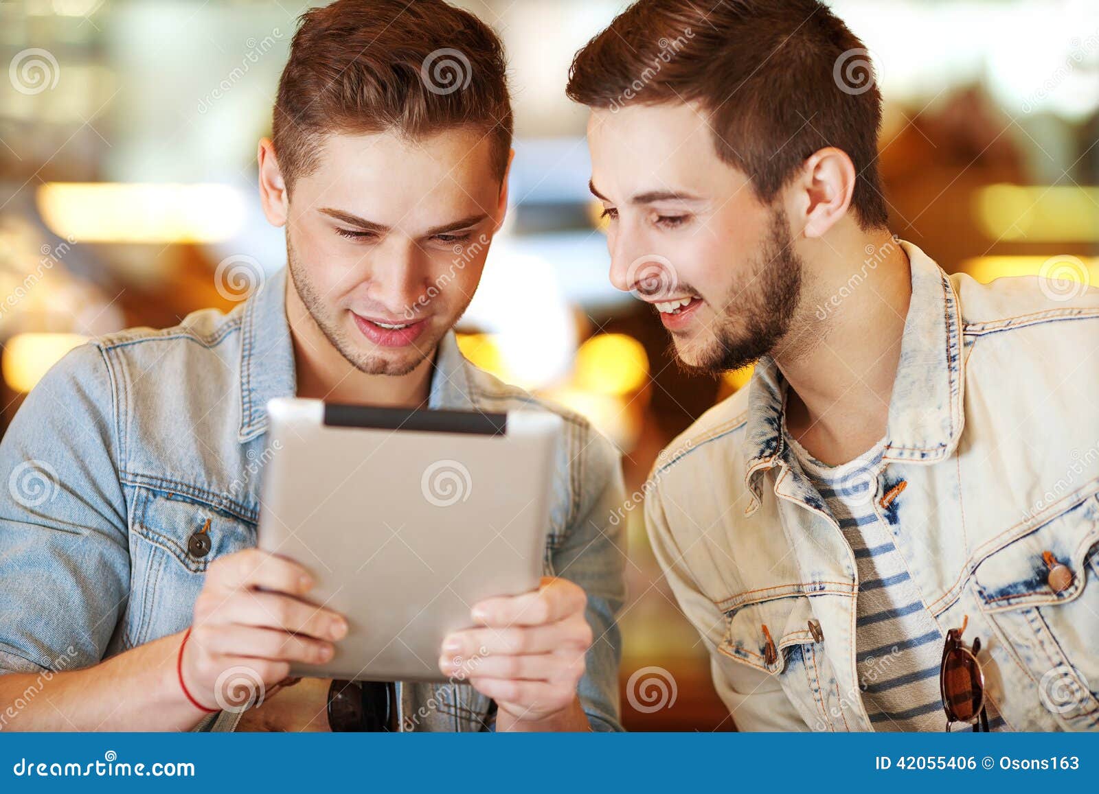 Young Hipster Guy Sitting in a Cafe Chatting and Drinking Coffe Stock ...