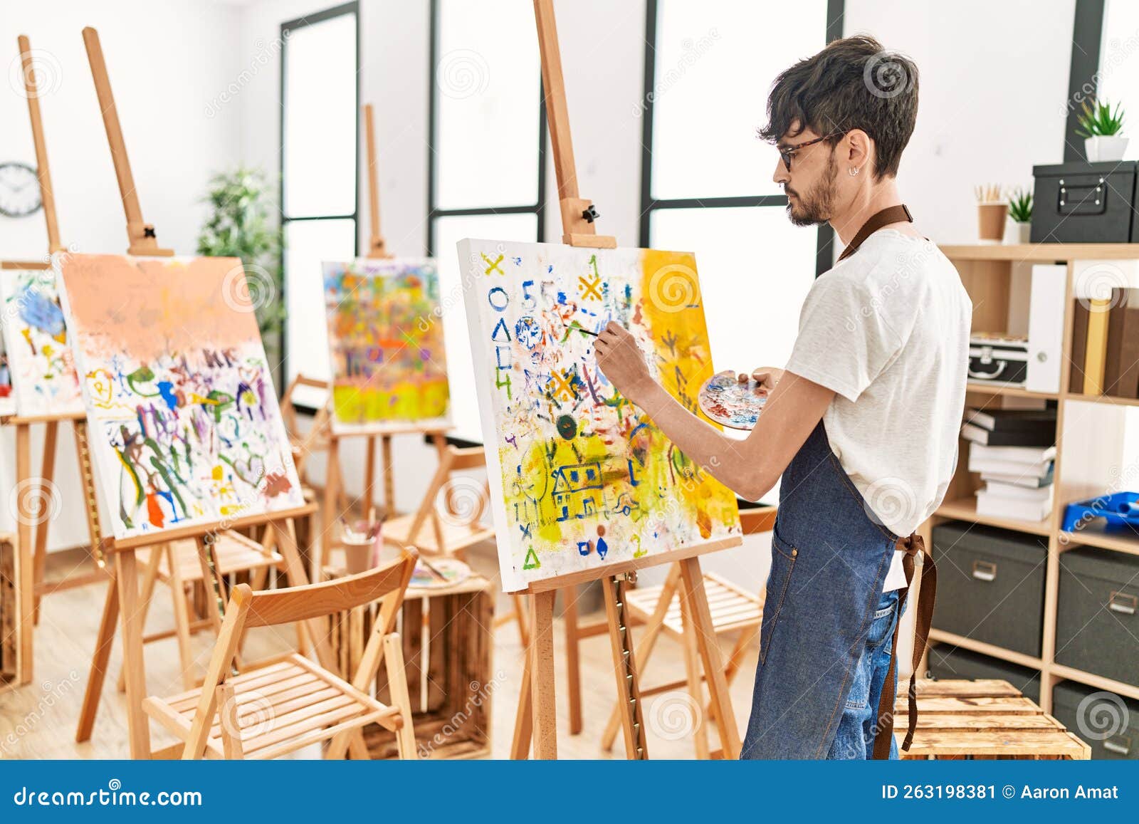 Young Hispanic Artist Man Concentrate Drawing at Art Studio Stock Image ...