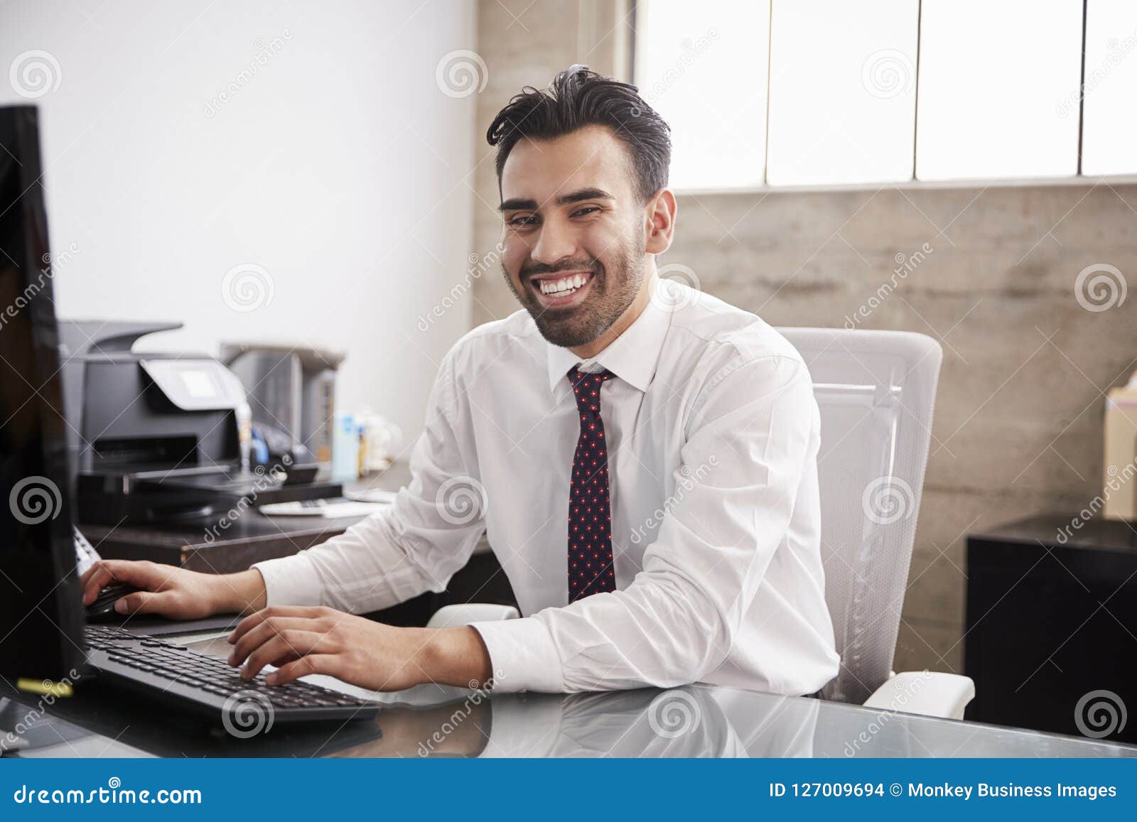 Young Hispanic Businessman Using Computer Smiling To Camera Stock Photo ...