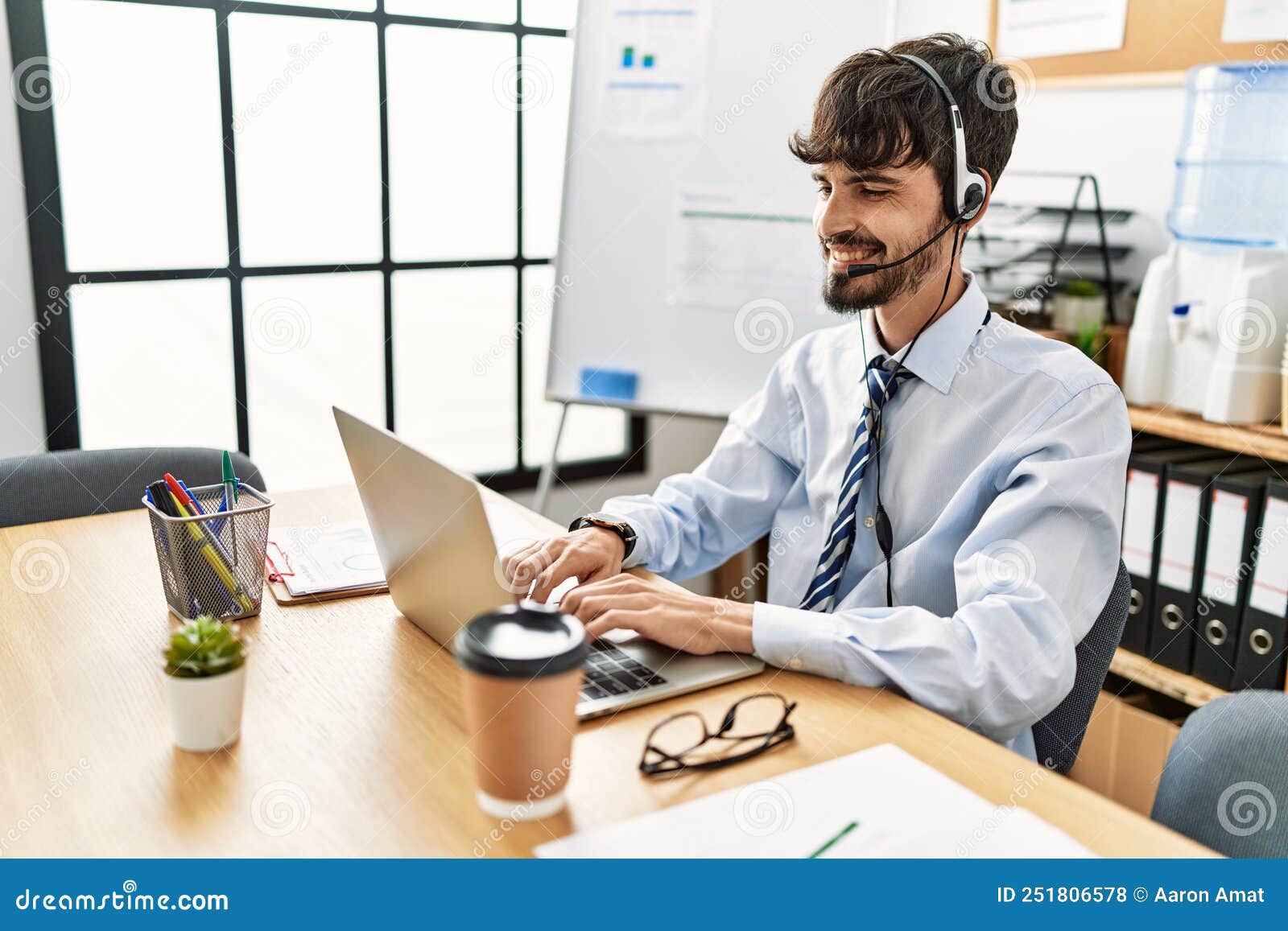 Young Hispanic Call Center Agent Man Smiling Happy Working at the ...