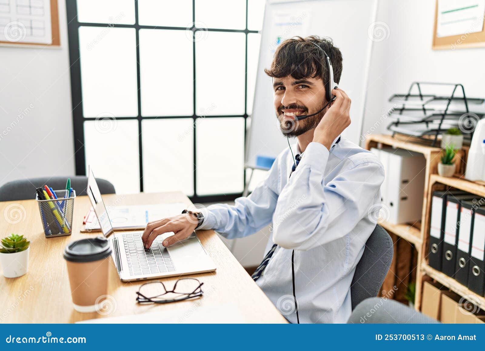 Young Hispanic Call Center Agent Man Smiling Happy Working at the ...