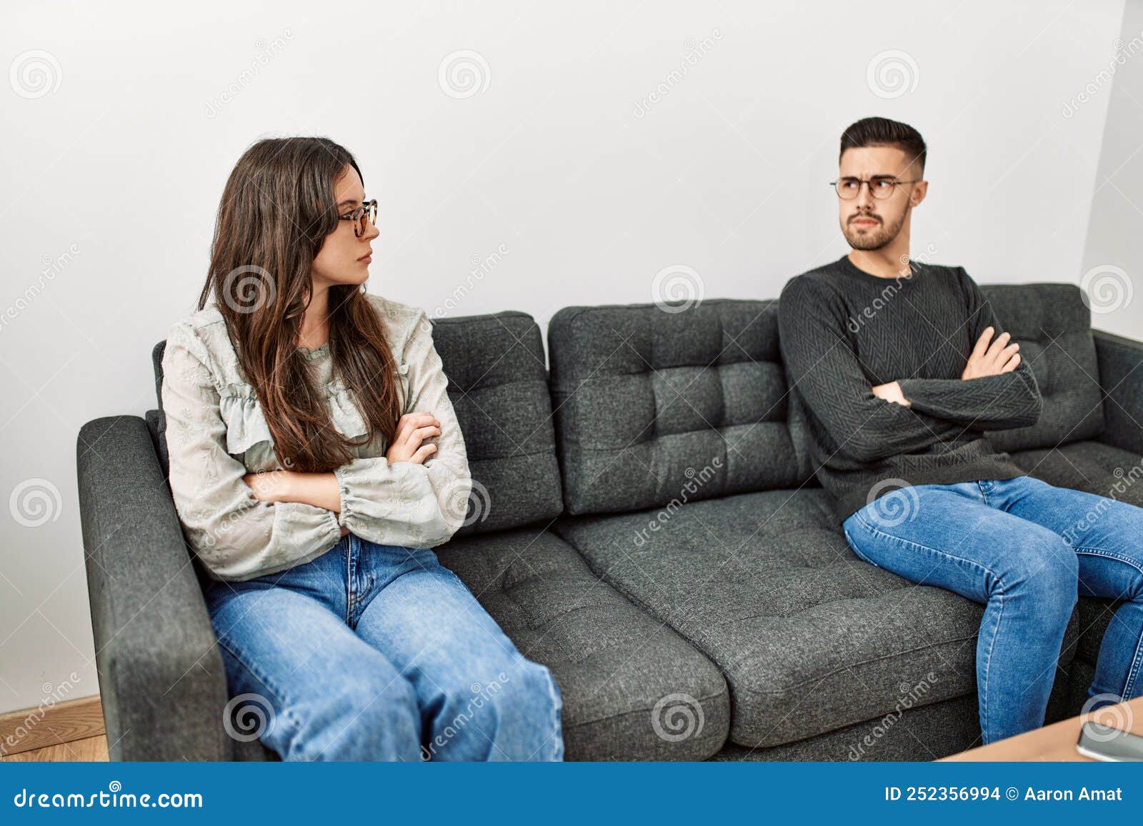 Young Hispanic Couple Angry Sitting on the Sofa in Silence at Home ...