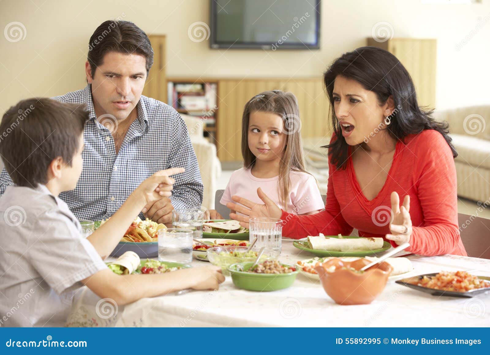 Young Hispanic Family Enjoying Meal at Home Stock Image - Image of ...