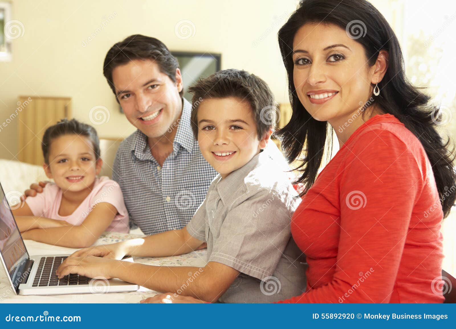 Young Hispanic Family Using Computer at Home Stock Photo - Image of ...