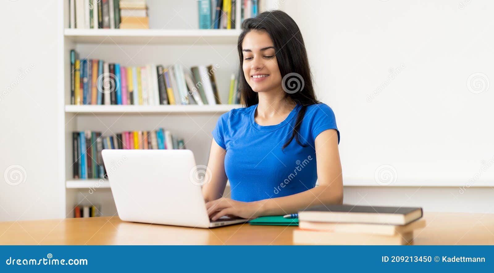 Young Hispanic Female Student Learning Online at Computer Stock Photo ...
