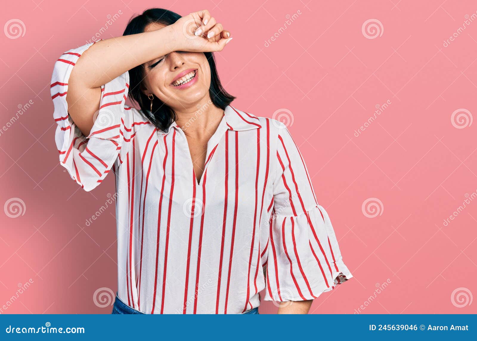Young Hispanic Girl Wearing Casual Clothes Covering Eyes With Arm