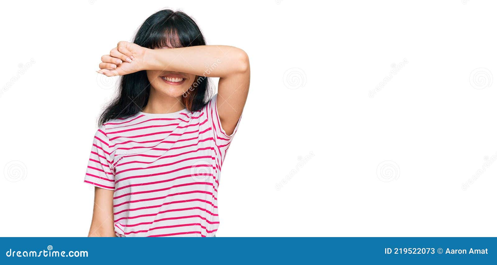 Young Hispanic Girl Wearing Casual Clothes Covering Eyes With Arm