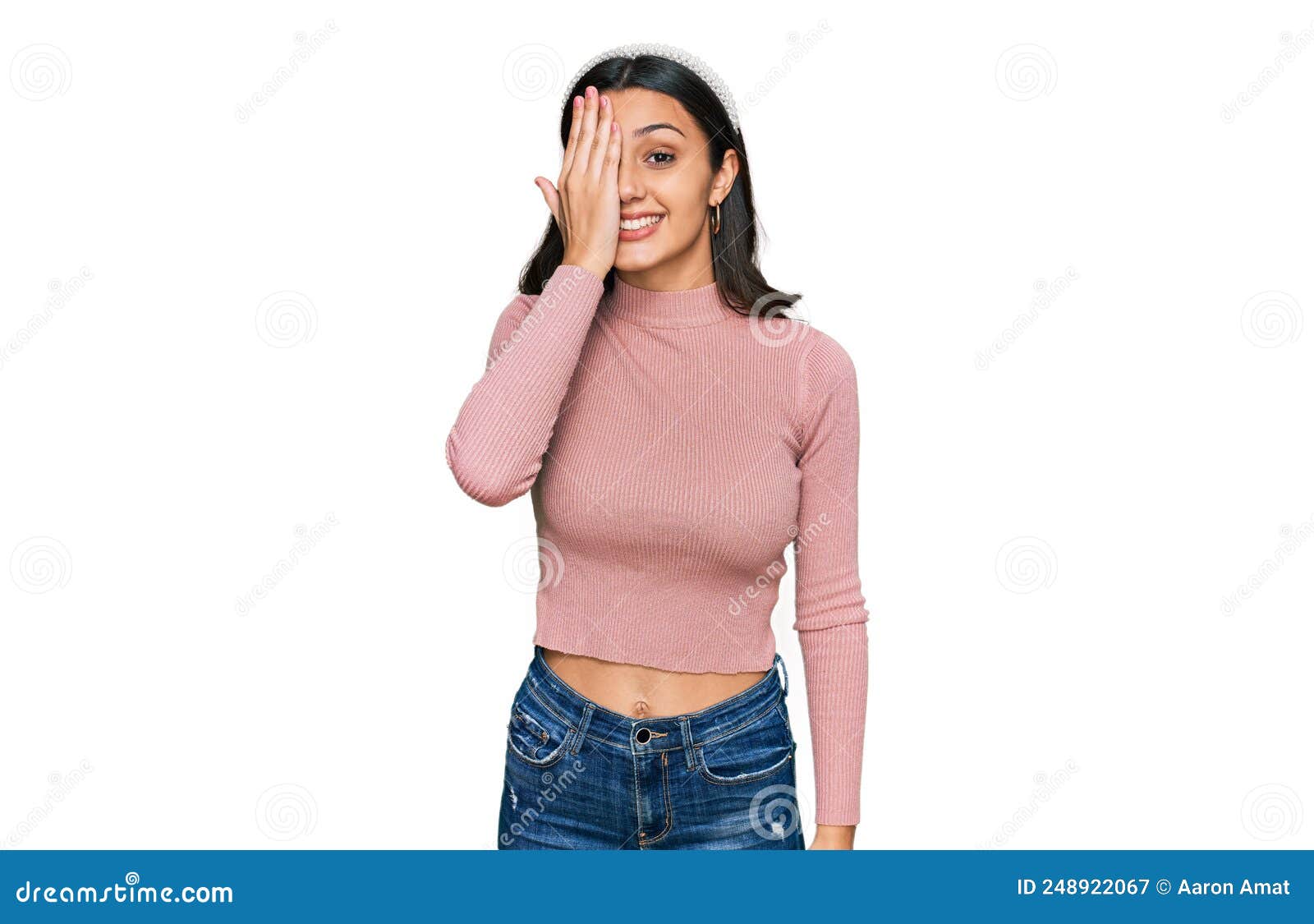 Young Hispanic Girl Wearing Casual Clothes Covering One Eye With Hand
