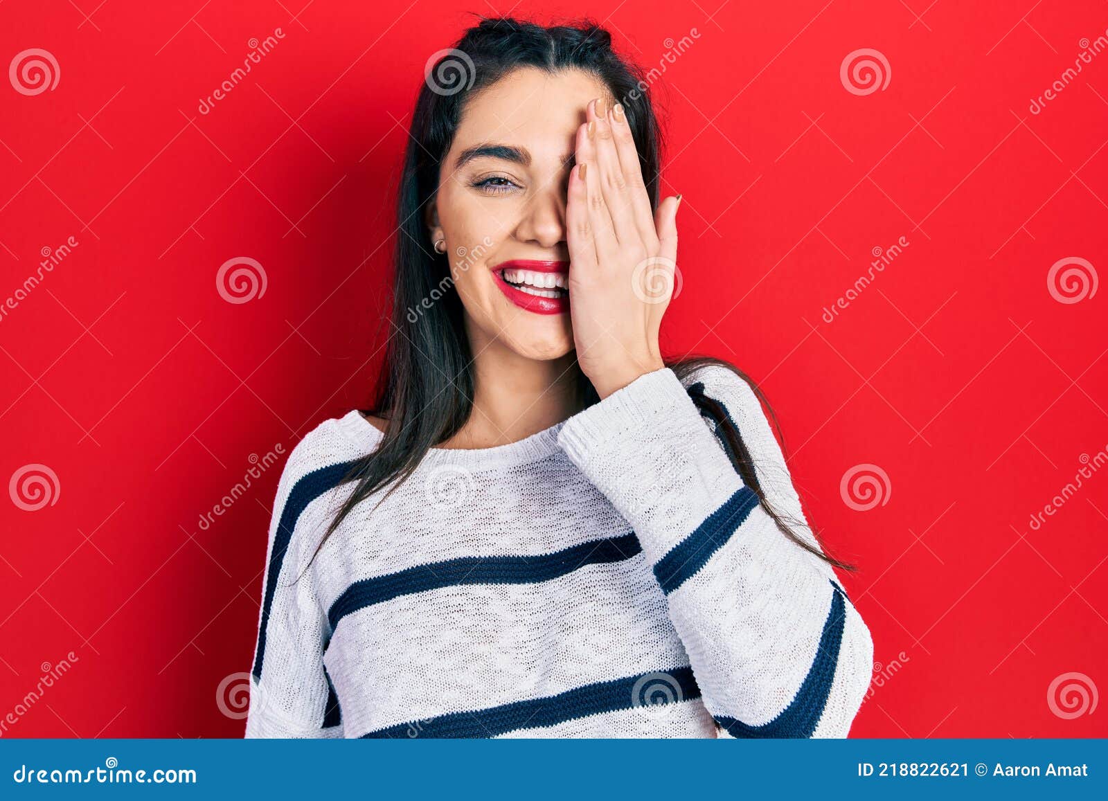 Young Hispanic Girl Wearing Casual Clothes Covering One Eye With Hand