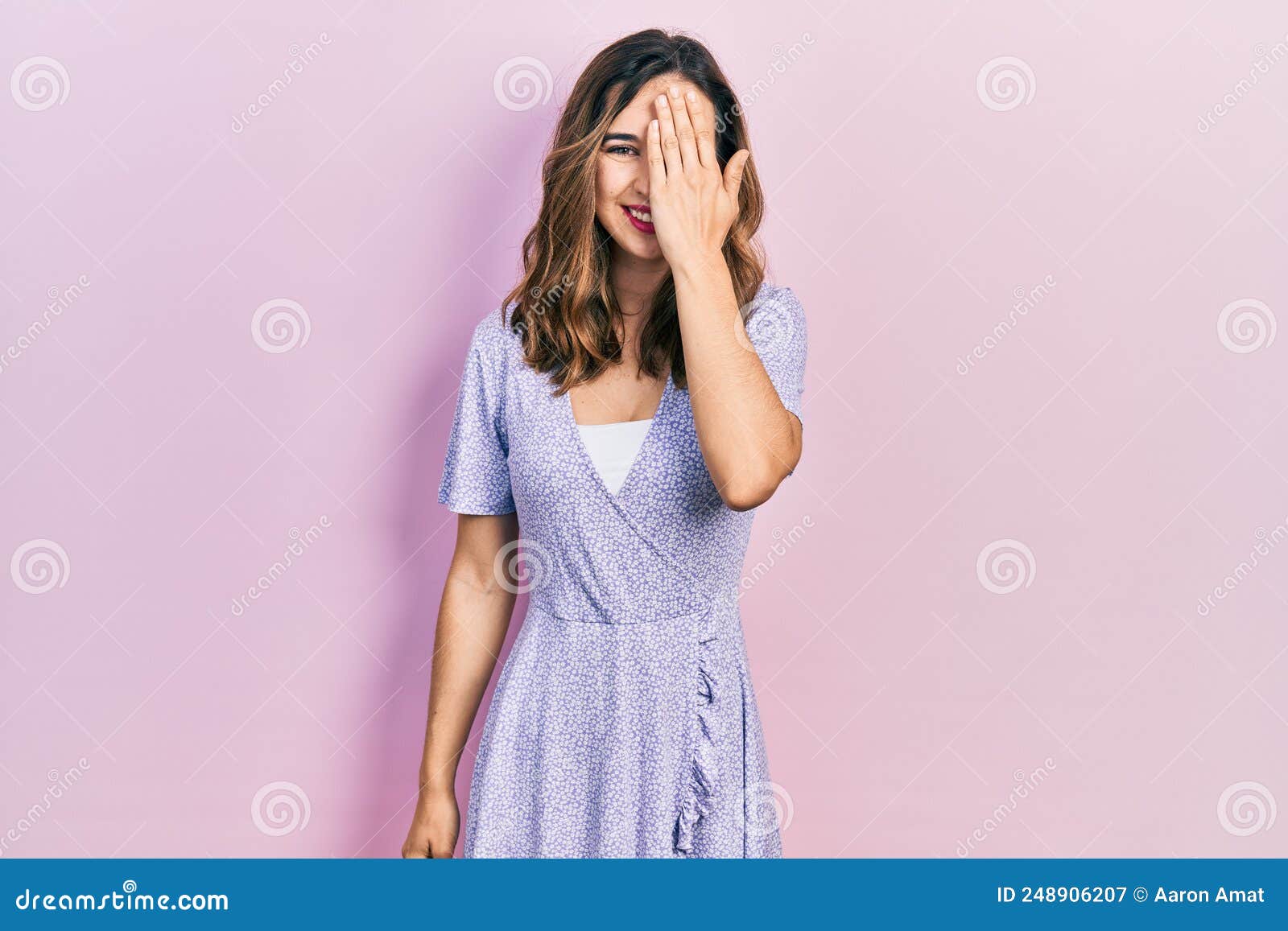 Young Hispanic Girl Wearing Casual Clothes Covering One Eye With Hand