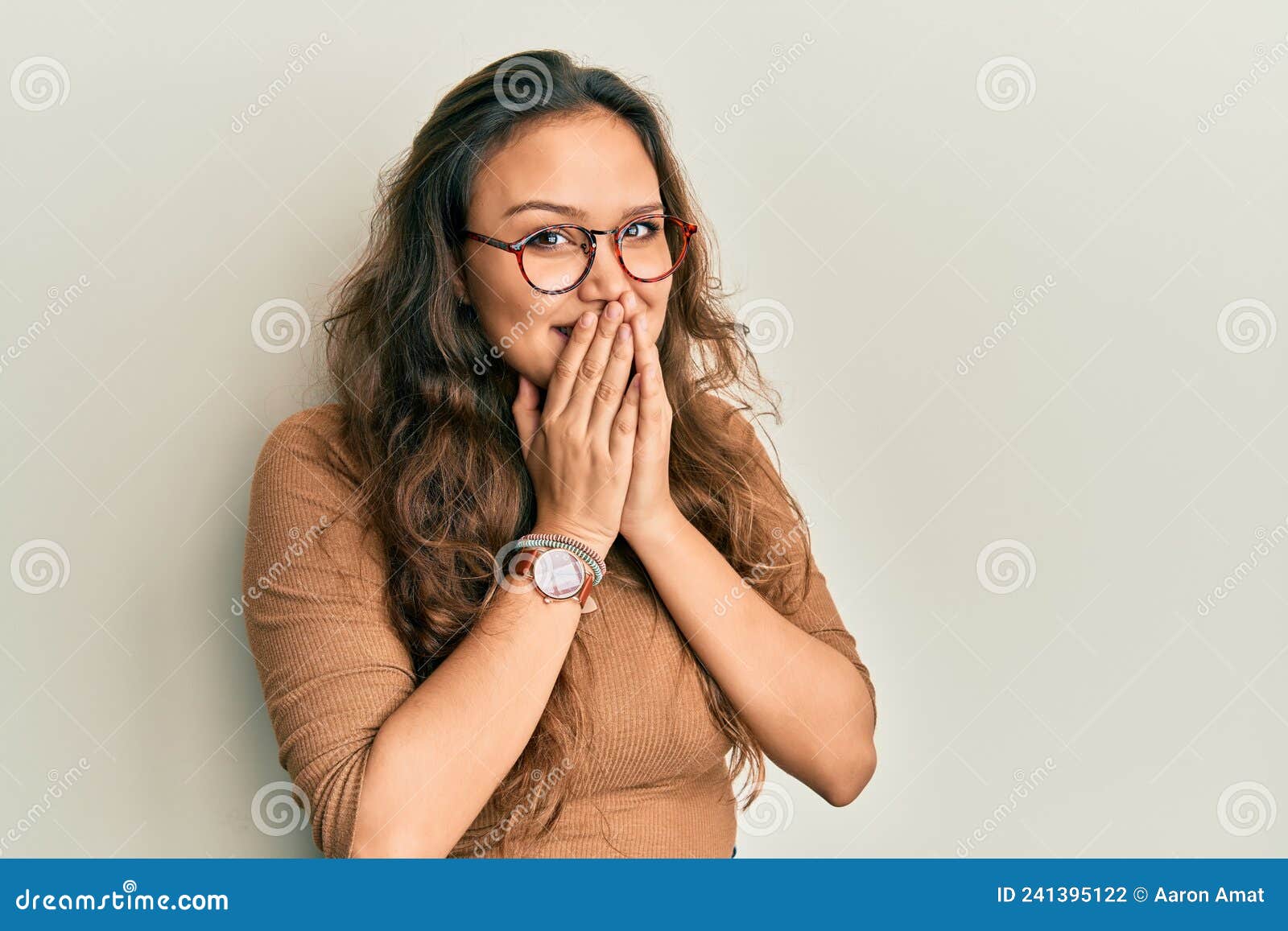Young Hispanic Girl Wearing Casual Clothes And Glasses Laughing And