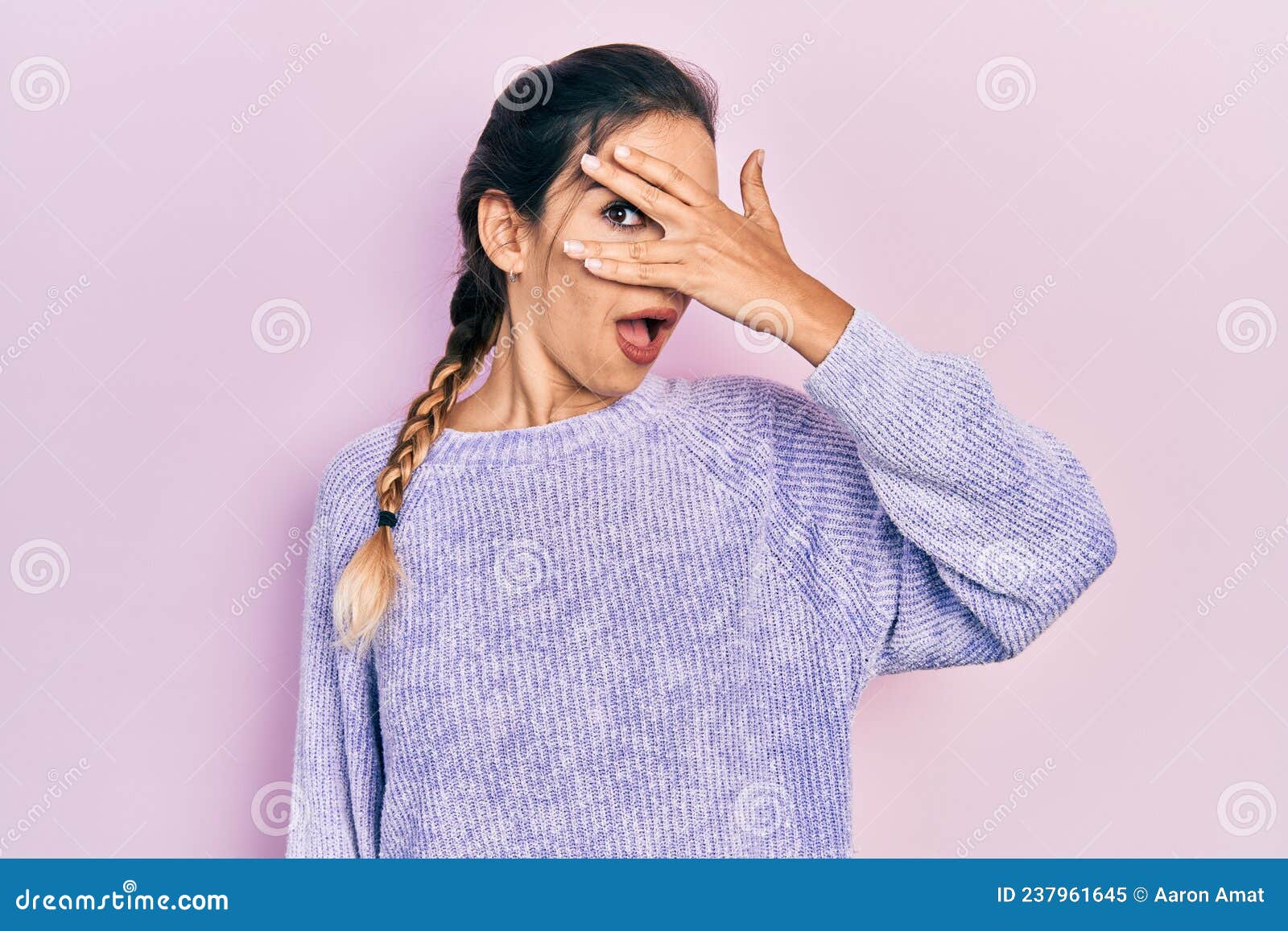 Young Hispanic Girl Wearing Casual Clothes Peeking In Shock Covering