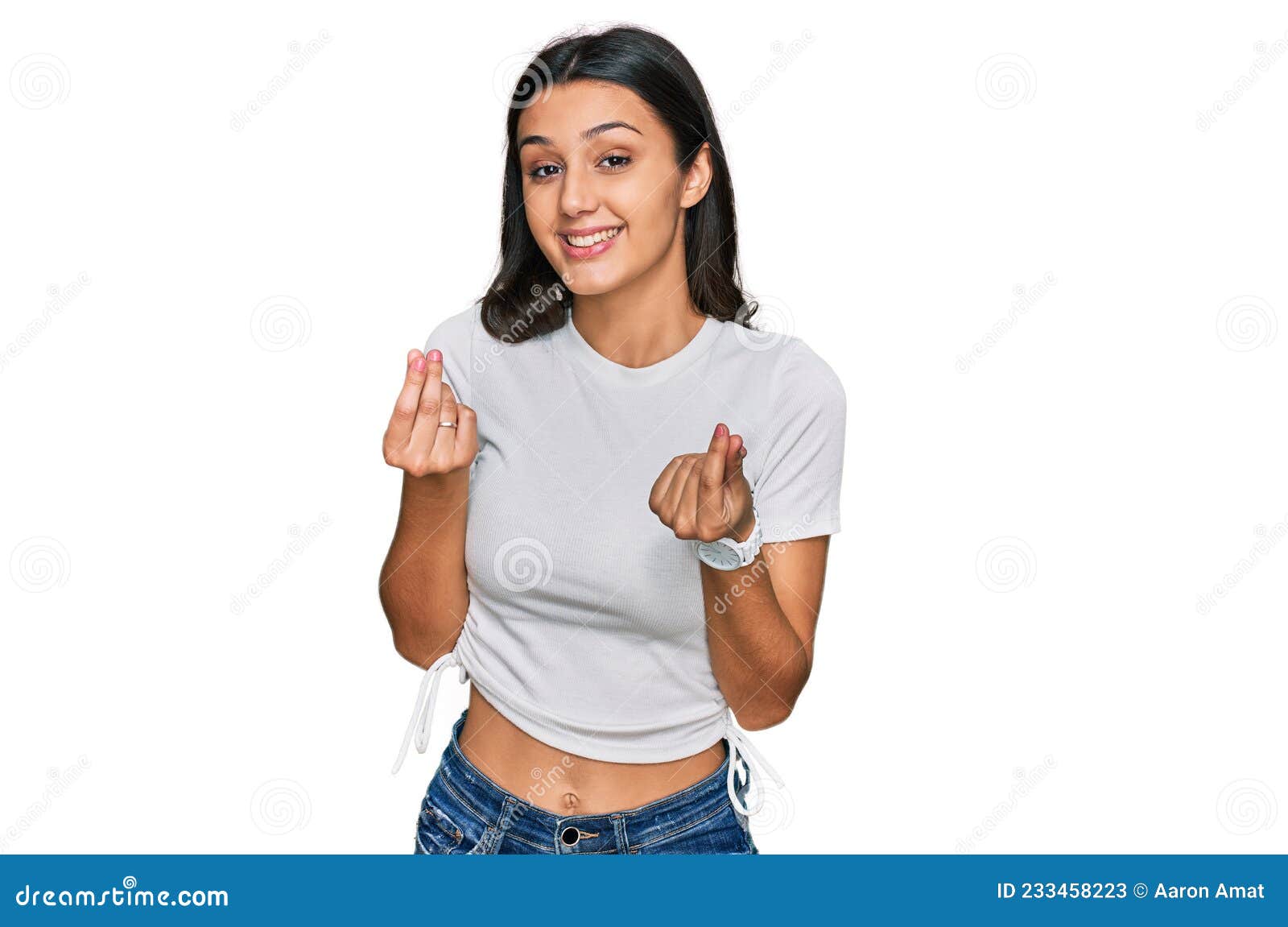 Young Hispanic Girl Wearing Casual White T Shirt Doing Money Gesture