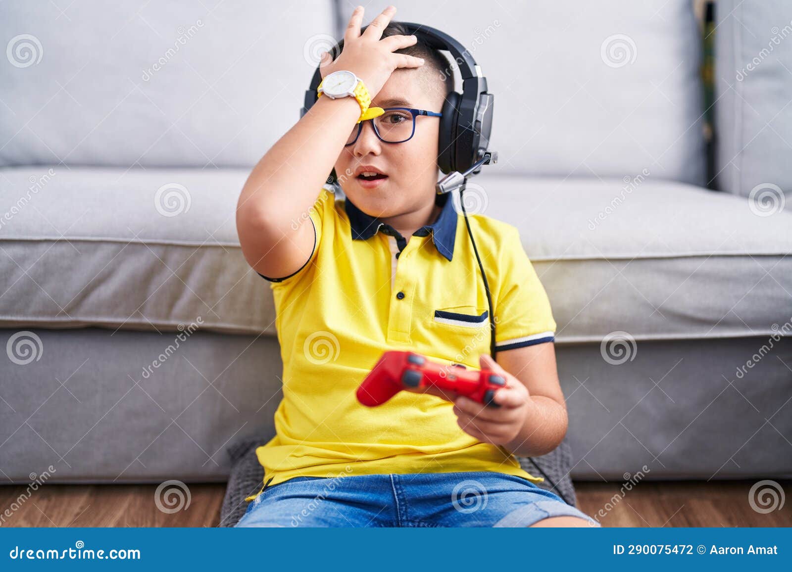 Young Hispanic Kid Playing Video Game Holding Controller Wearing ...