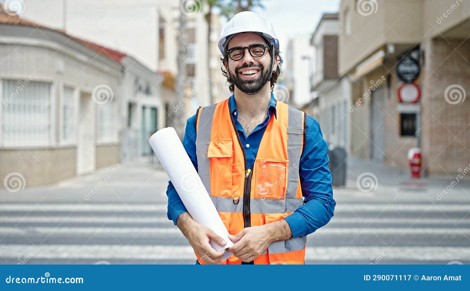 Young Hispanic Man Architect Smiling Confident Holding Blueprints at ...