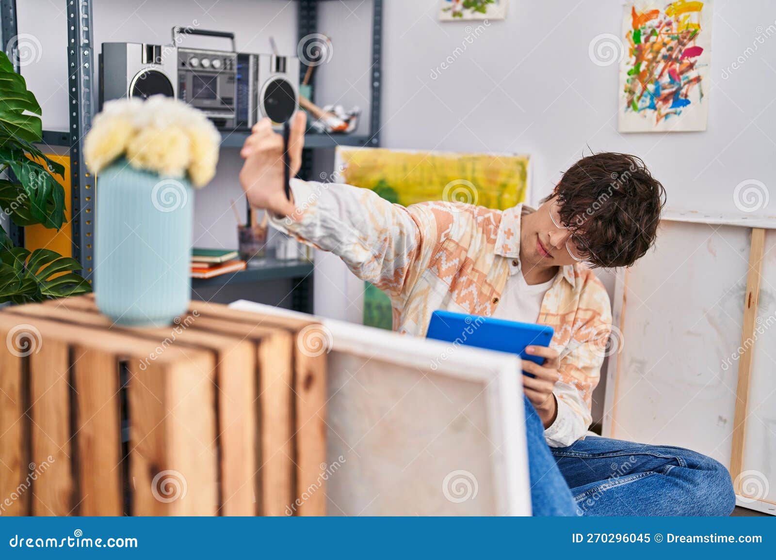 Young Hispanic Man Artist Using Touchpad Drawing at Art Studio Stock ...