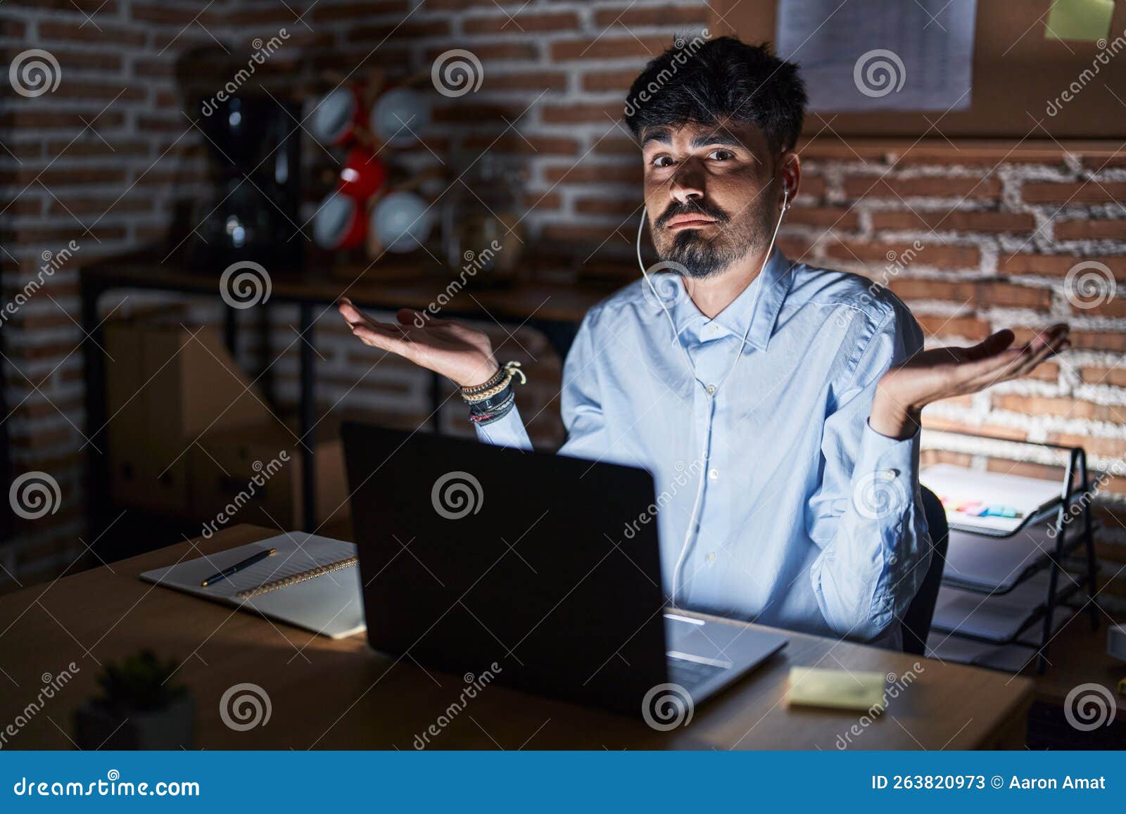 Young Hispanic Man with Beard Working at the Office at Night Clueless ...