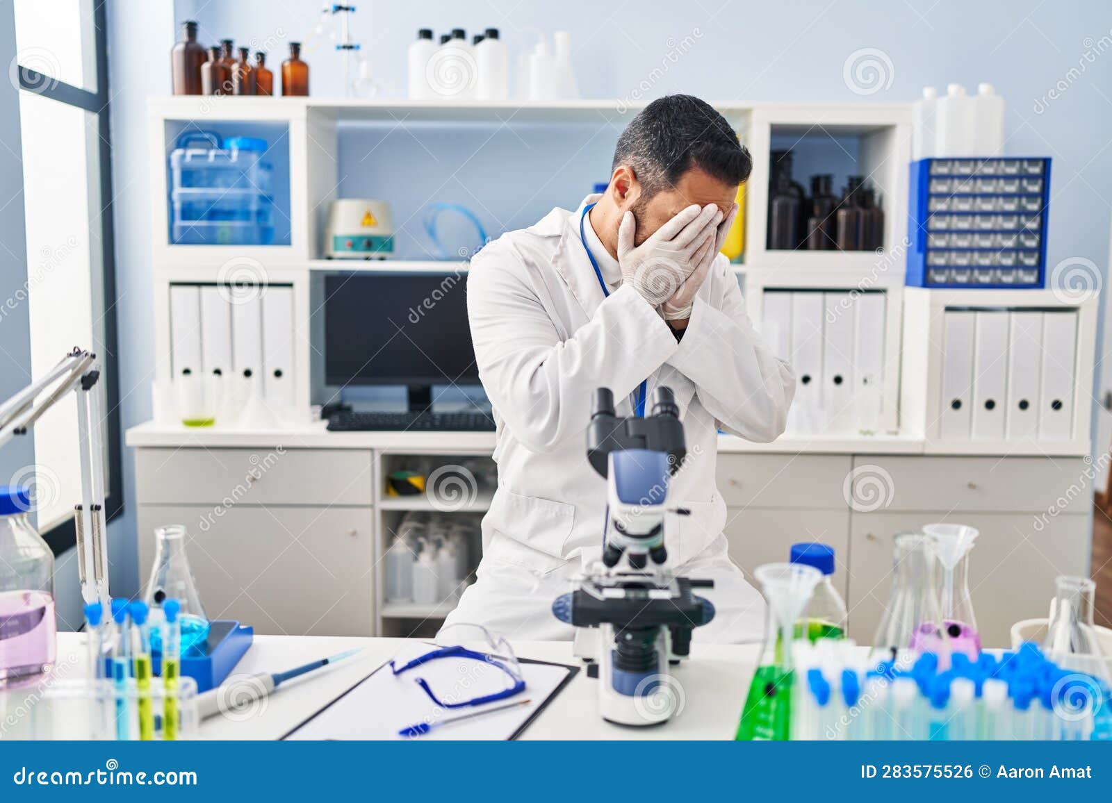 Young Hispanic Man with Beard Working at Scientist Laboratory with Sad ...