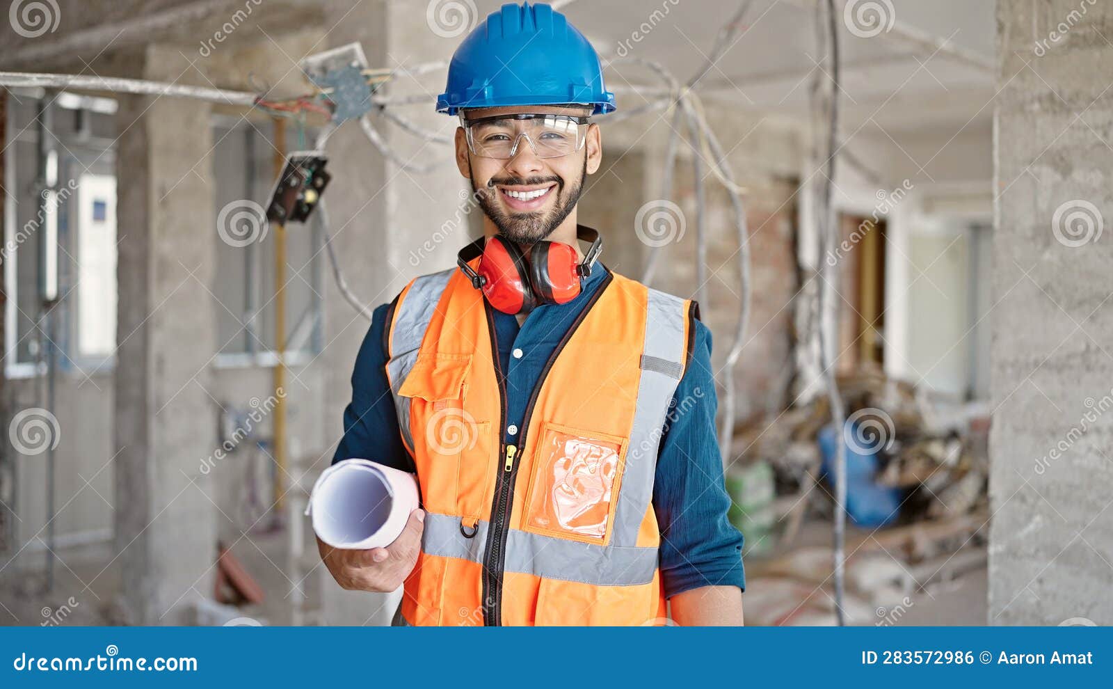Young Hispanic Man Builder Smiling Confident Standing with Blueprints ...