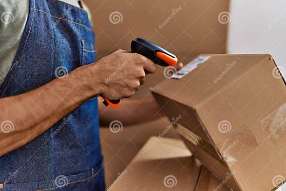 Young Hispanic Man Business Worker Scanning Package Using Barcode ...
