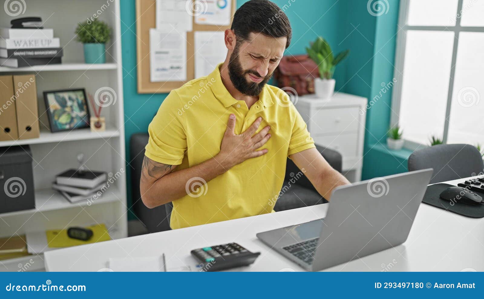 Young Hispanic Man Business Worker Suffering Heart Attack Working at ...