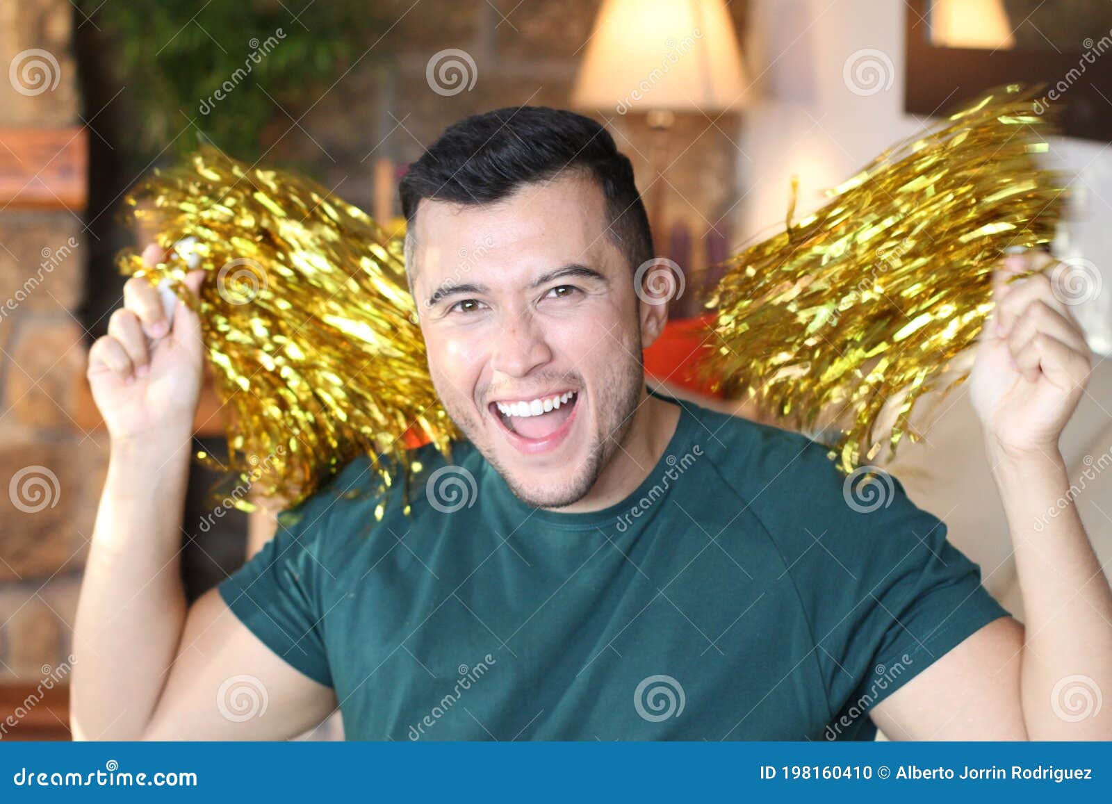 Young Hispanic Man Cheerleading at Home Stock Photo - Image of house ...