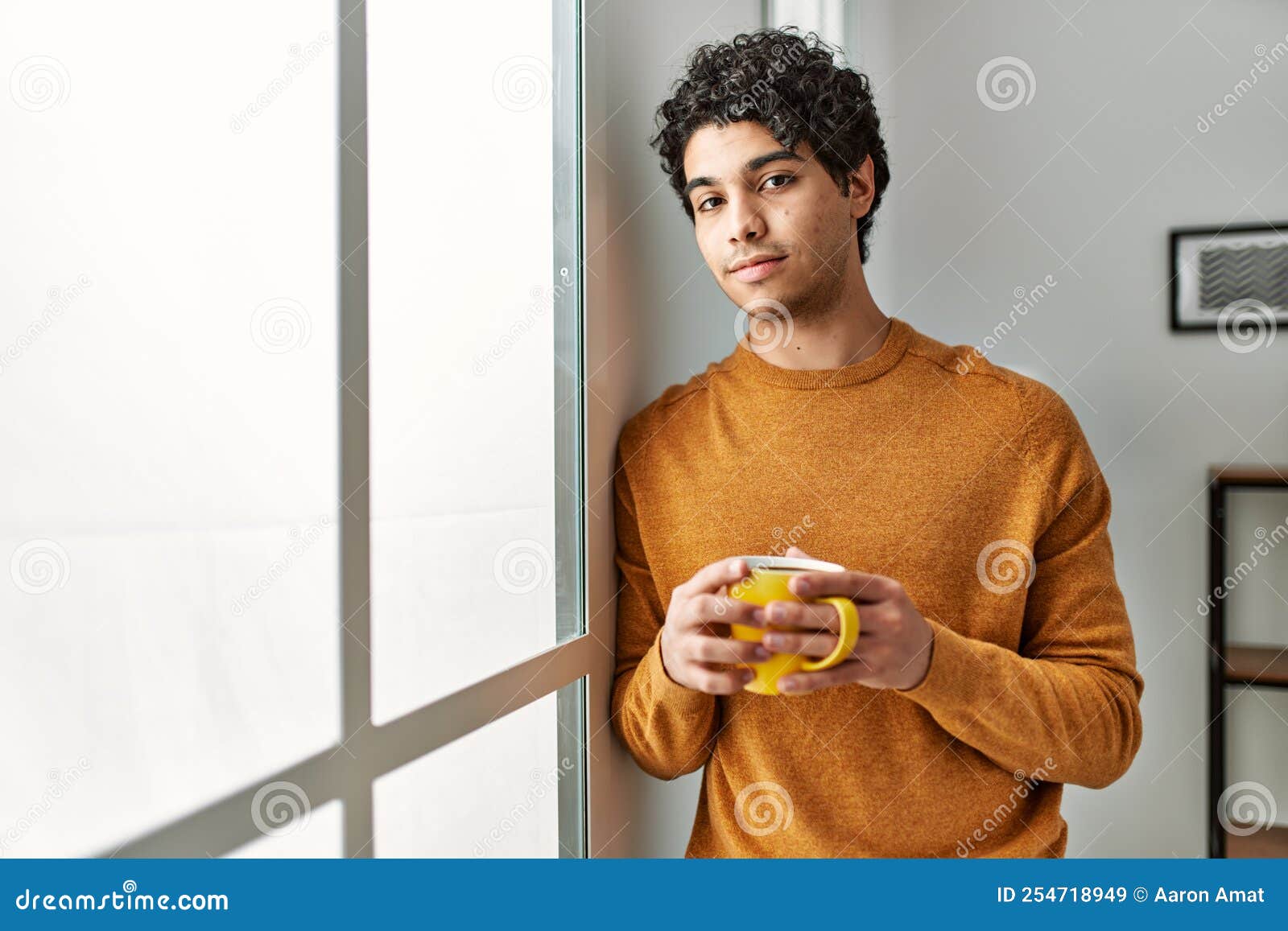 Young Hispanic Man Drinking Coffee Standing at Home Stock Image - Image ...