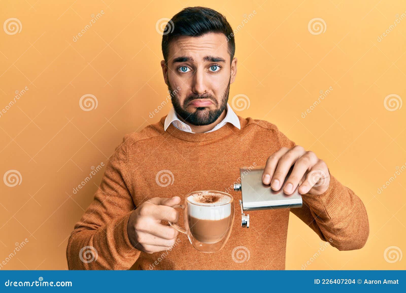Young Hispanic Man Drinking a Cup of Coffee with Alcohol Depressed and ...