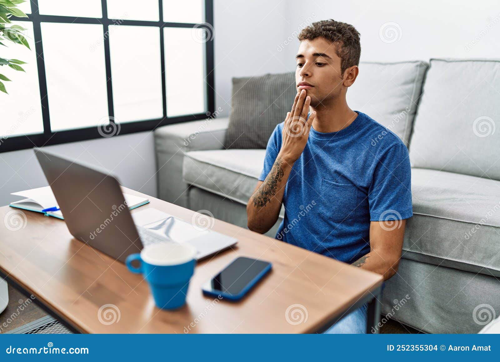 Young Hispanic Man Gesturing Sign Language on Video Call at Home Stock ...