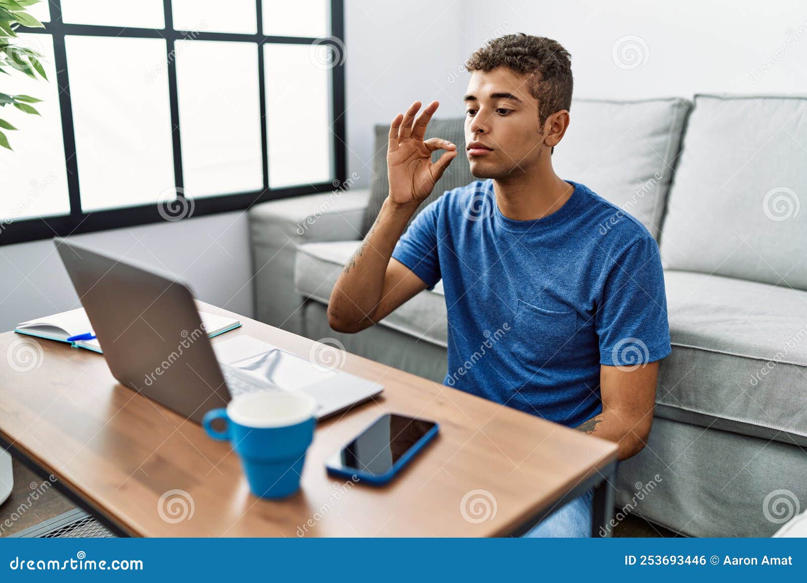 Young Hispanic Man Gesturing Sign Language on Video Call at Home Stock ...