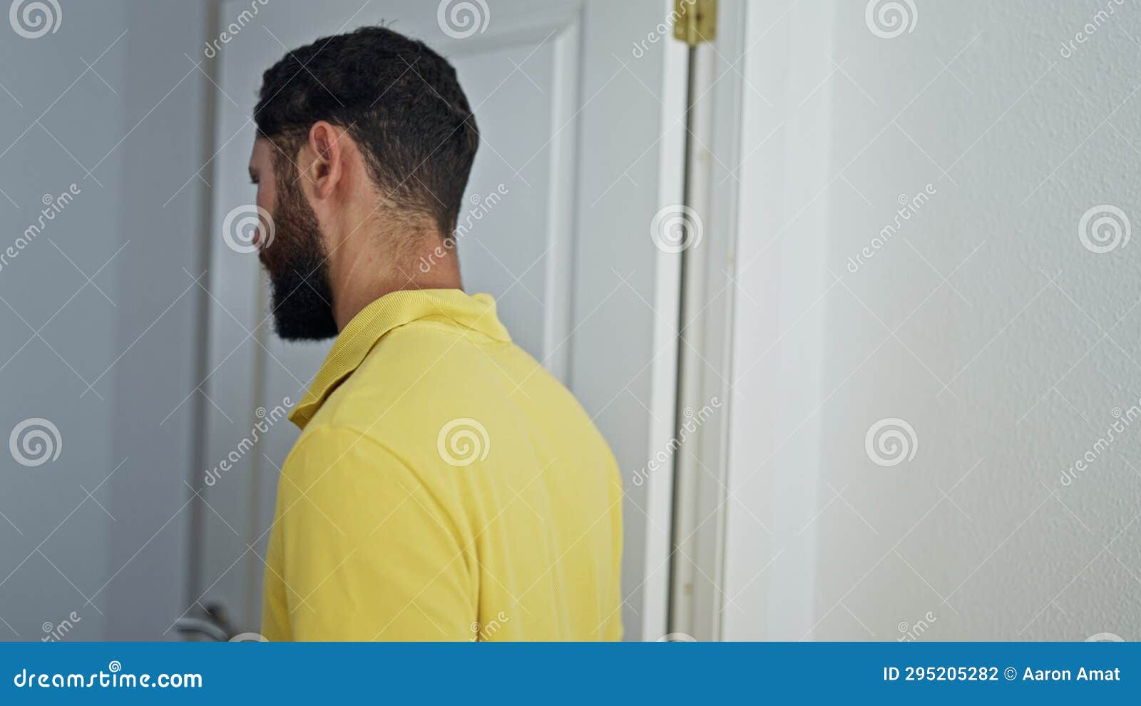 Young Hispanic Man Getting in House with Serious Face at Home Stock ...