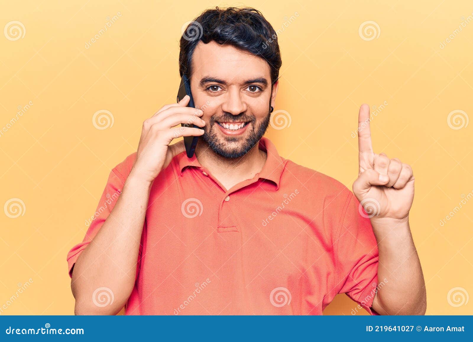 Young Hispanic Man Having Conversation Talking on the Smartphone ...