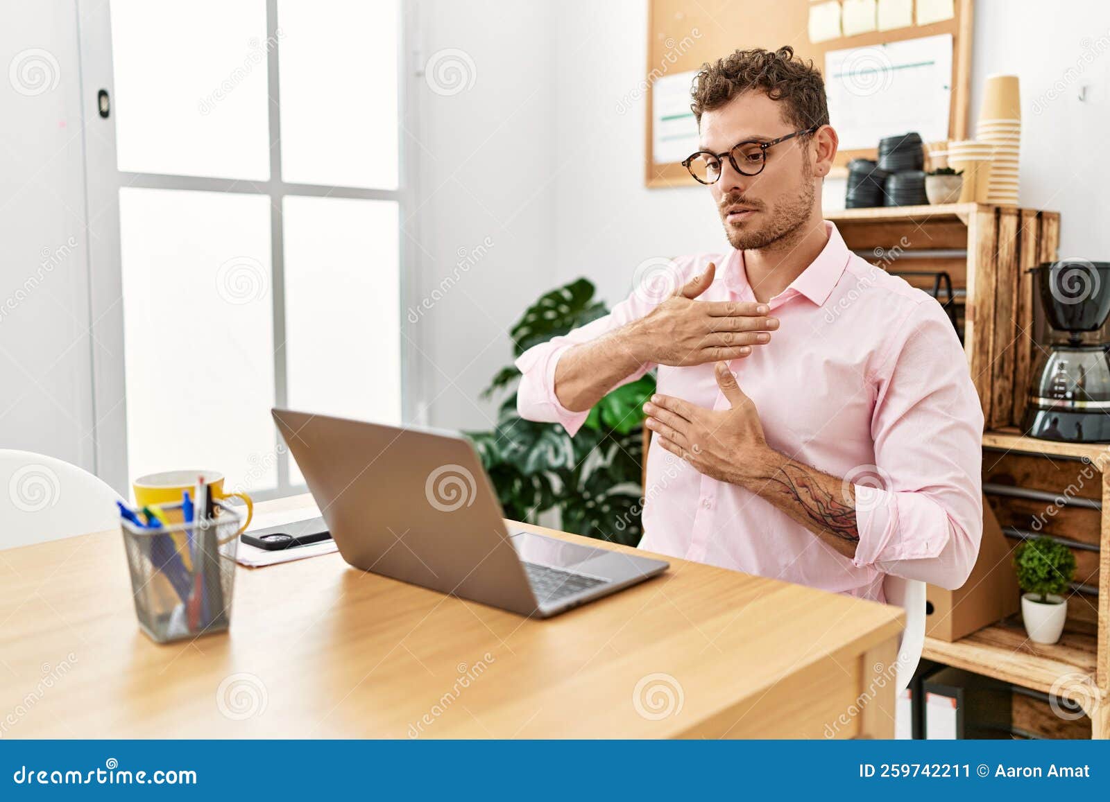 Young Hispanic Man Having Video Call Communicating with Deaf Sign ...