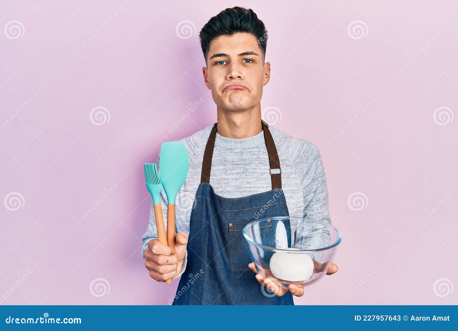 Young Hispanic Man Holding Bread Dough and Cooking Tools Depressed and ...
