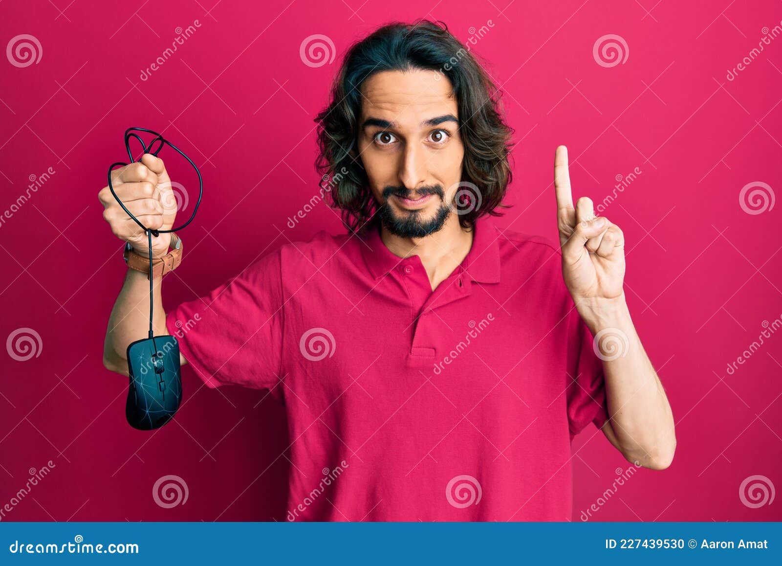 Young Hispanic Man Holding Mouse Computer Smiling with an Idea or ...