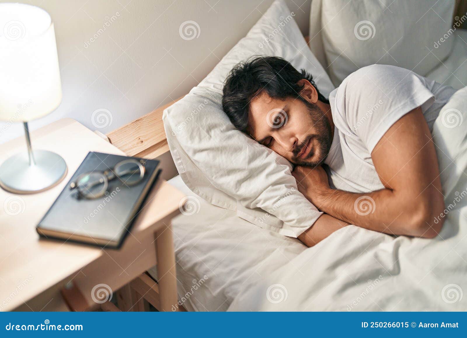 Young Hispanic Man Lying on Bed Sleeping at Bedroom Stock Image - Image ...