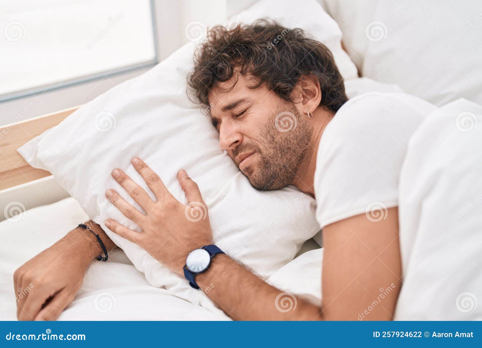 Young Hispanic Man Lying on Bed Sleeping at Bedroom Stock Photo - Image ...