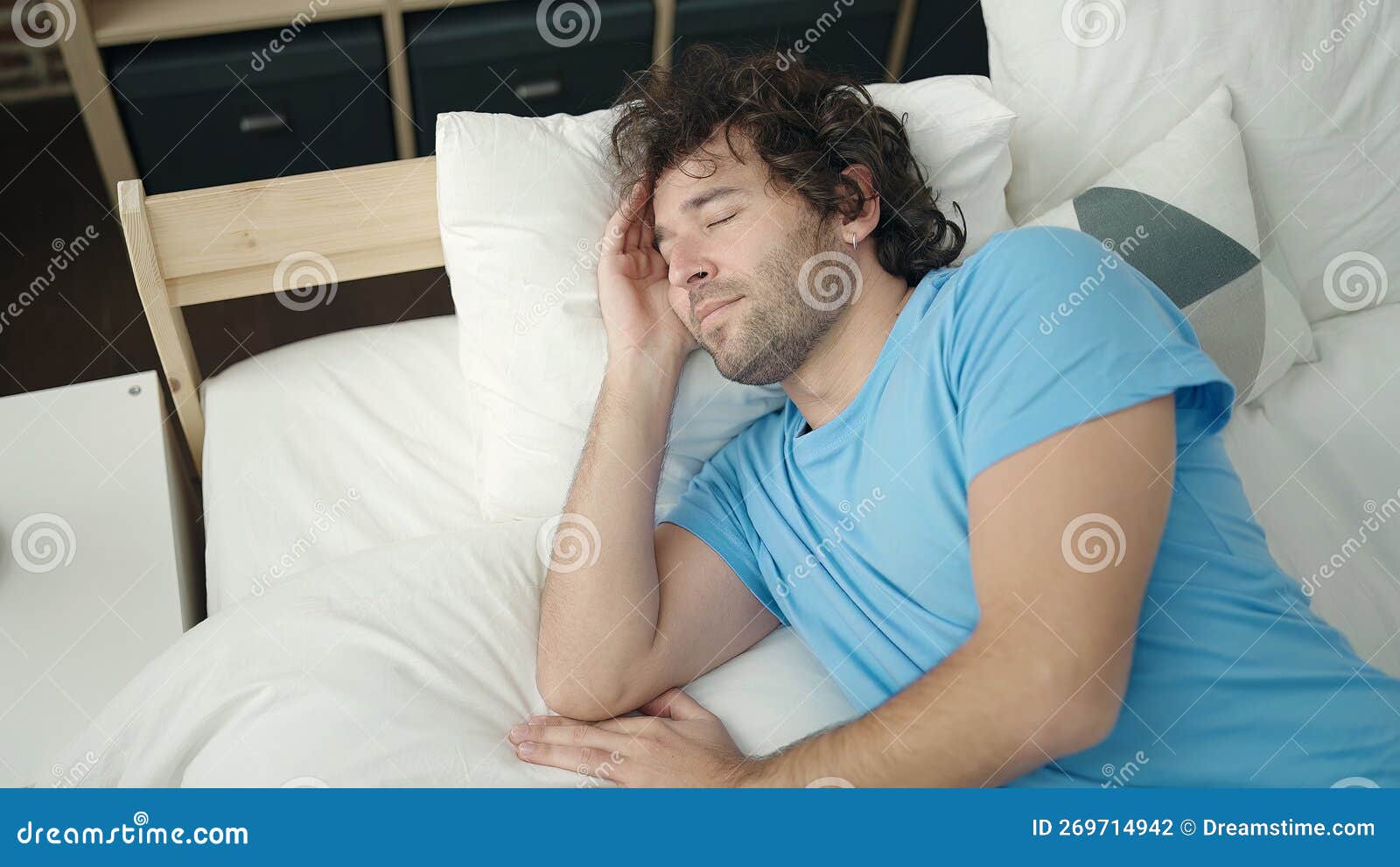 Young Hispanic Man Lying on Bed Sleeping at Bedroom Stock Photo - Image ...