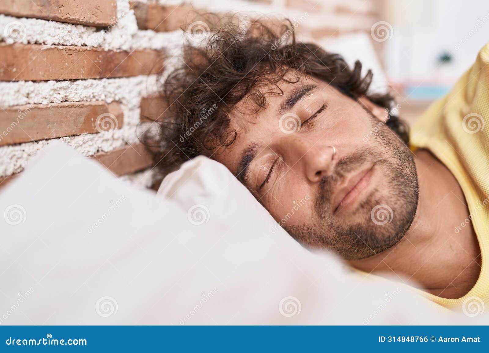 Young Hispanic Man Lying on Bed Sleeping at Bedroom Stock Photo - Image ...
