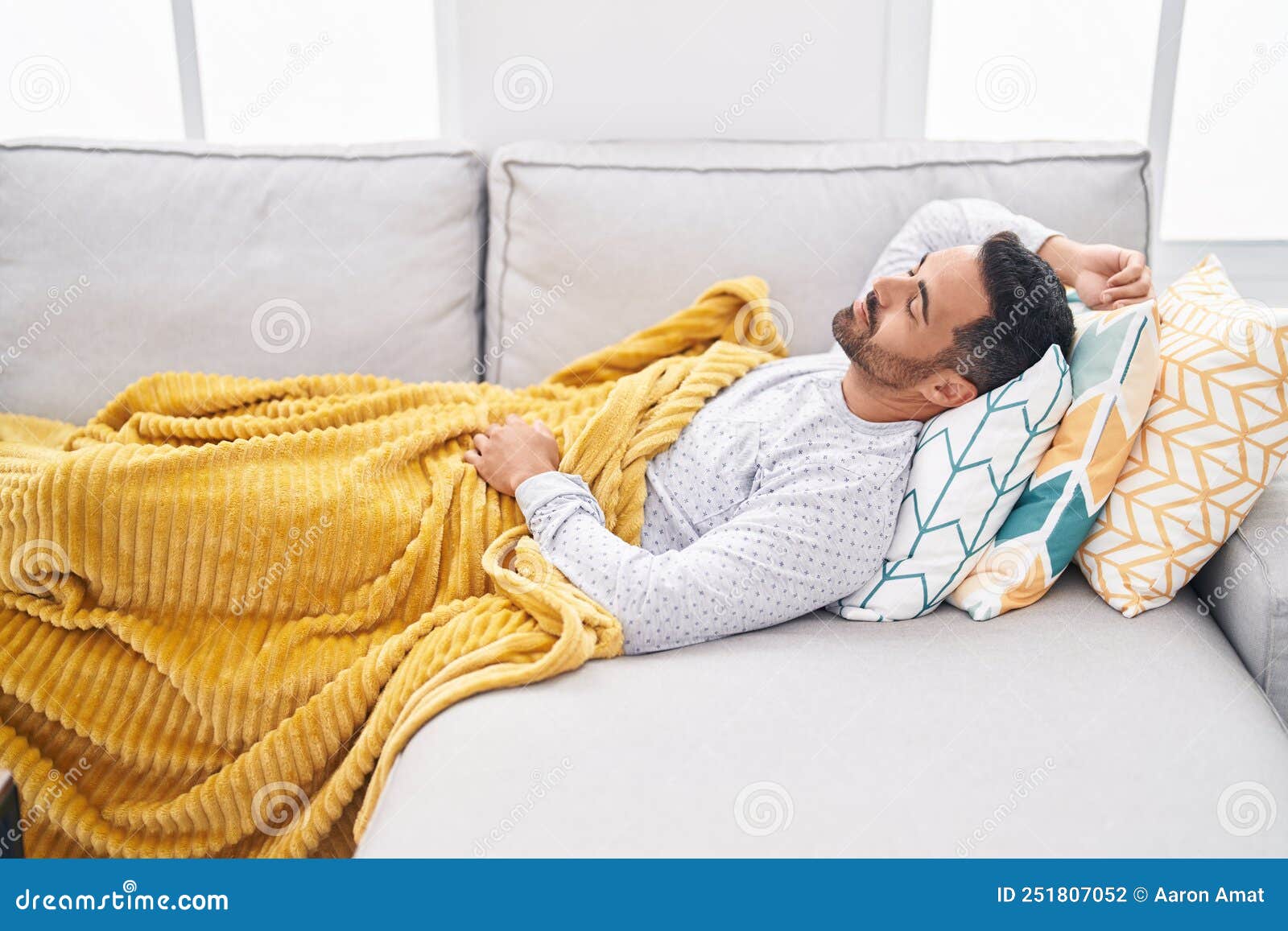 Young Hispanic Man Lying on Sofa Sleeping at Home Stock Photo - Image ...