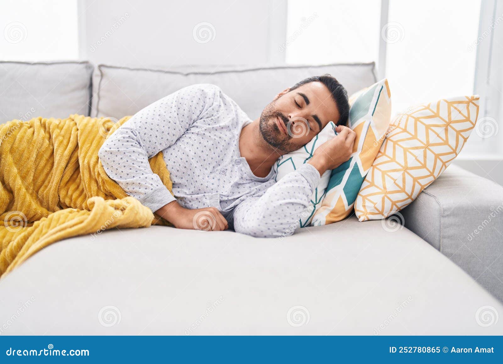 Young Hispanic Man Lying on Sofa Sleeping at Home Stock Image - Image ...