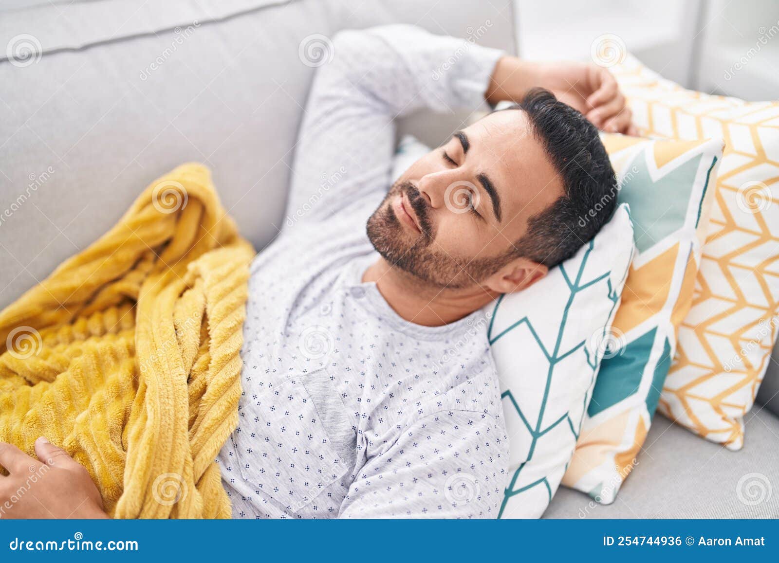 Young Hispanic Man Lying on Sofa Sleeping at Home Stock Photo - Image ...