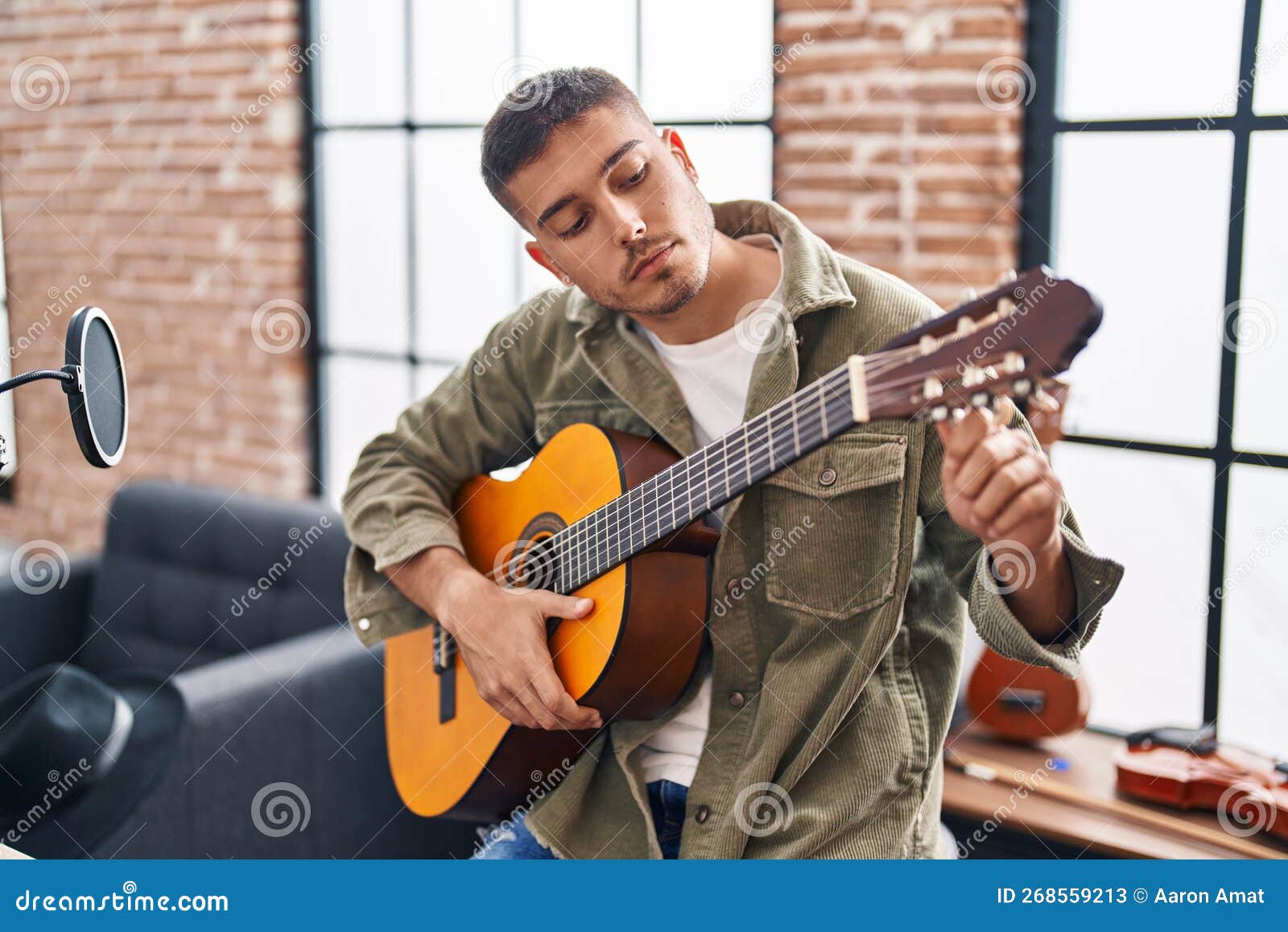 Young Hispanic Man Musician Playing Classical Guitar at Music Studio ...