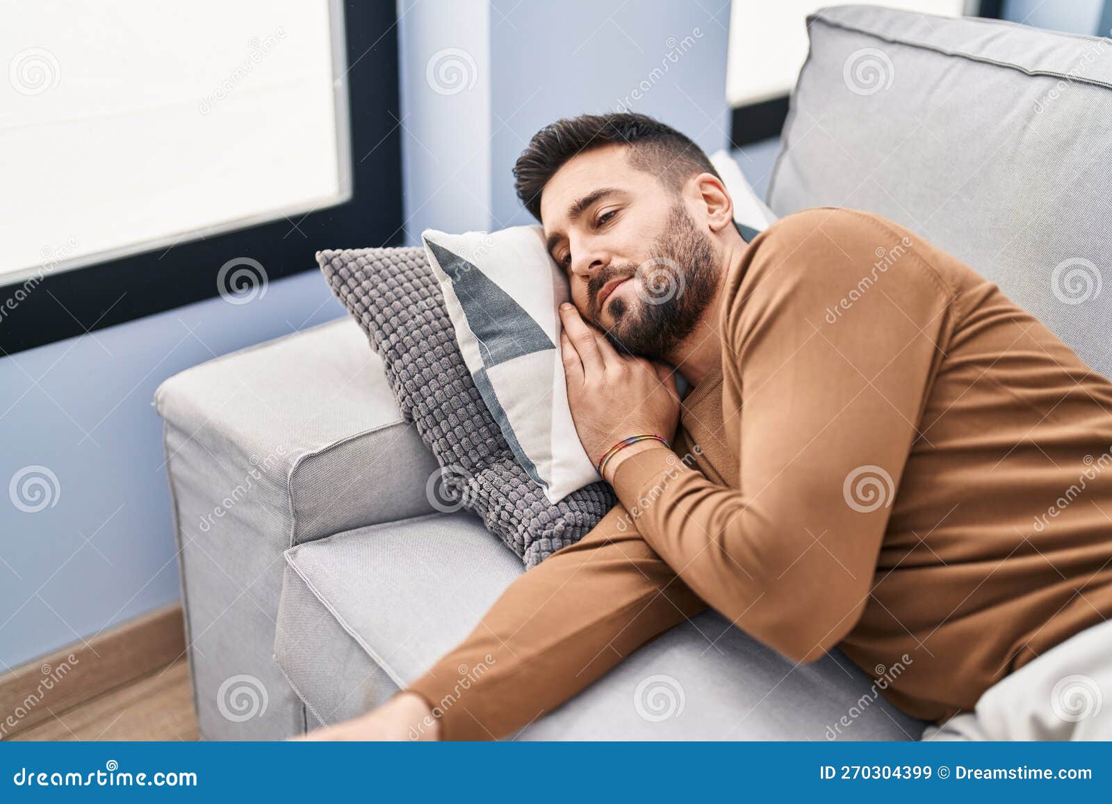 Young Hispanic Man Sleeping on Sofa at Home Stock Image - Image of ...