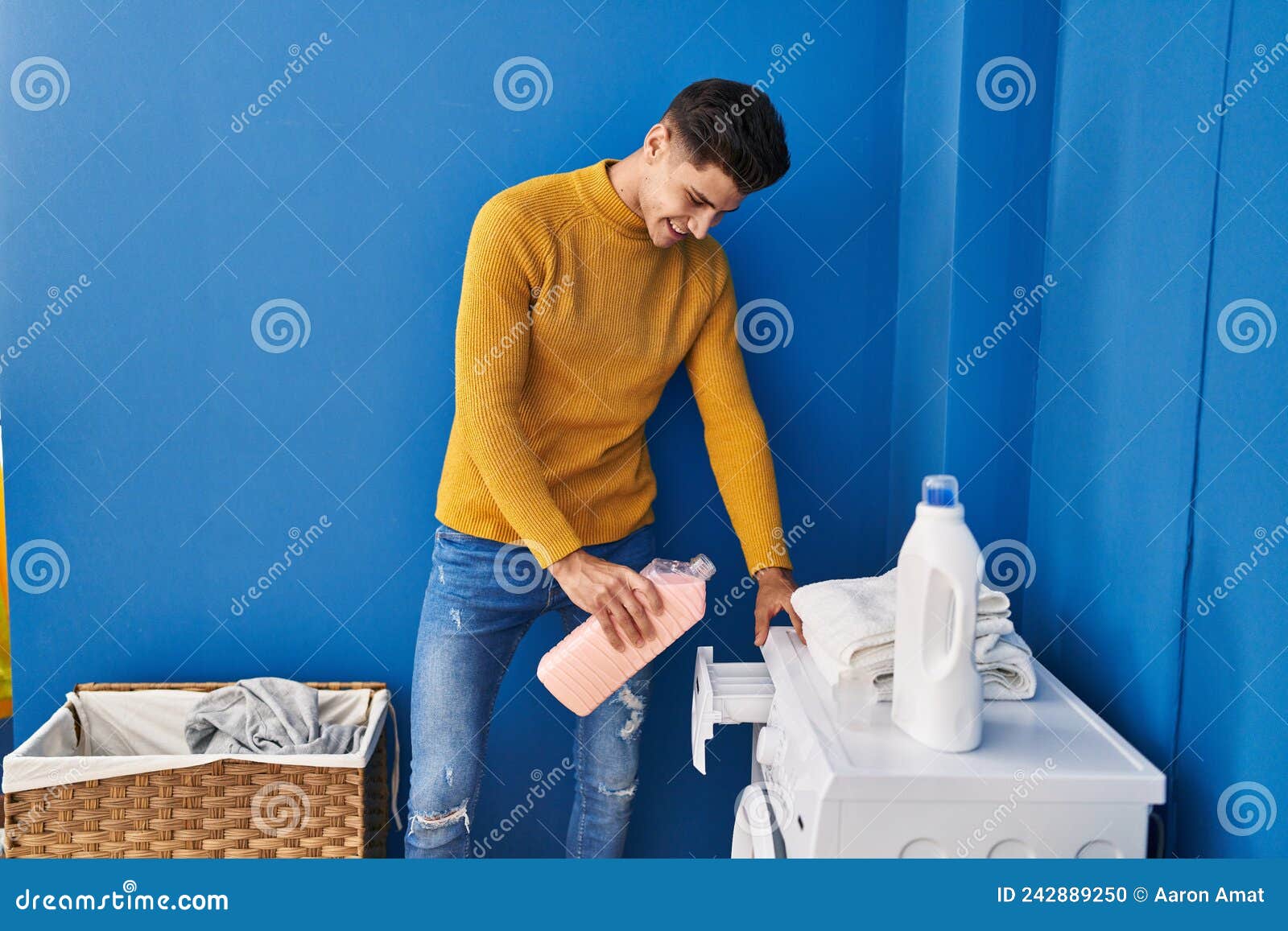 Young Hispanic Man Smiling Confident Pouring Detergent on Washing ...