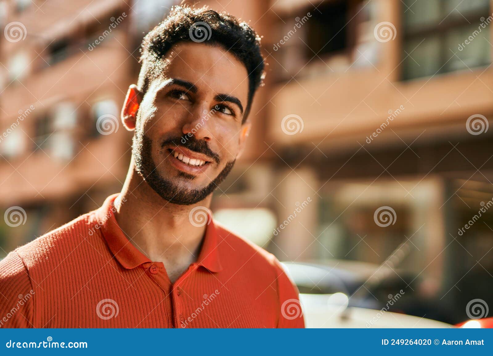 Young Hispanic Man Smiling Happy Standing at the City Stock Photo ...